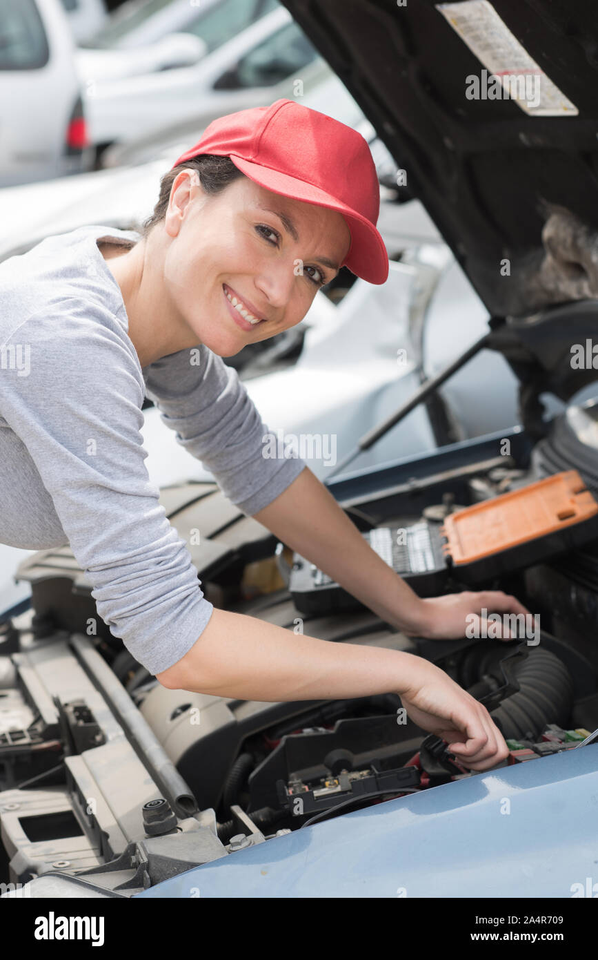 female mechanic working on car engine Stock Photo - Alamy