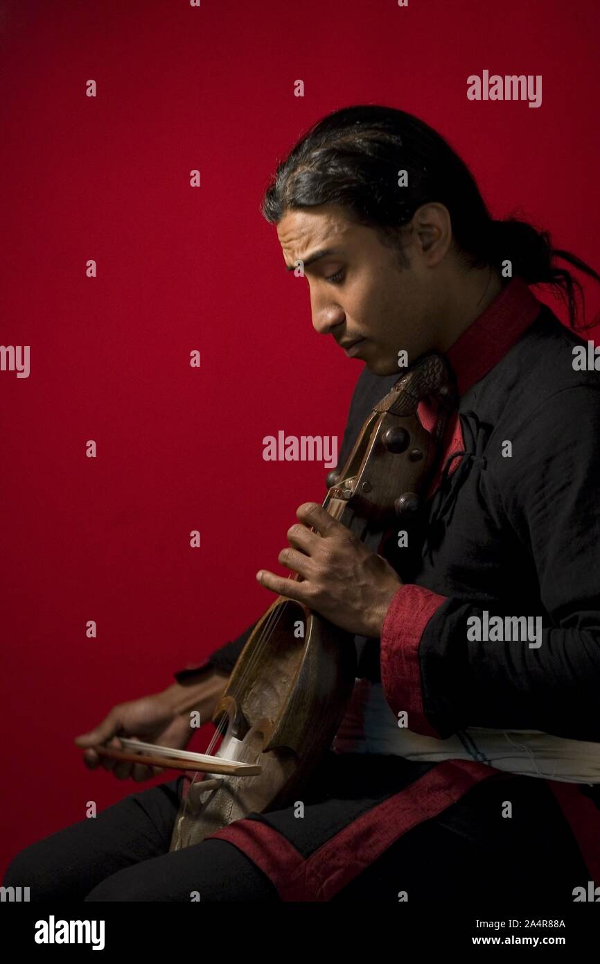 Model Release No: 042.Rashil Palanchoke plays the sarangi in popular ...