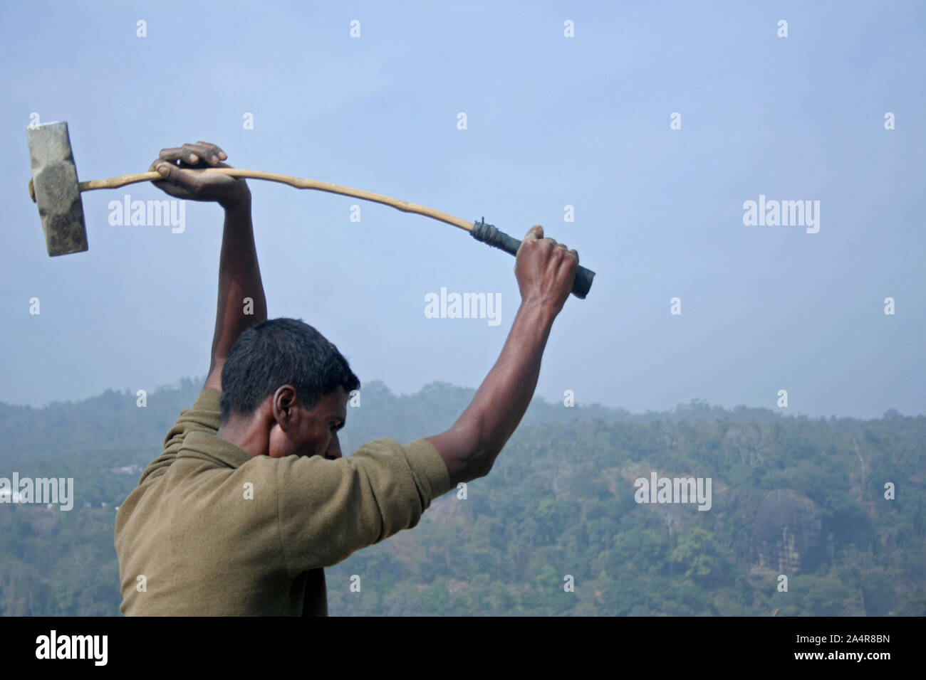 A man breaking stones at the bank of Dauki River in Jaflong, Sylhet ...