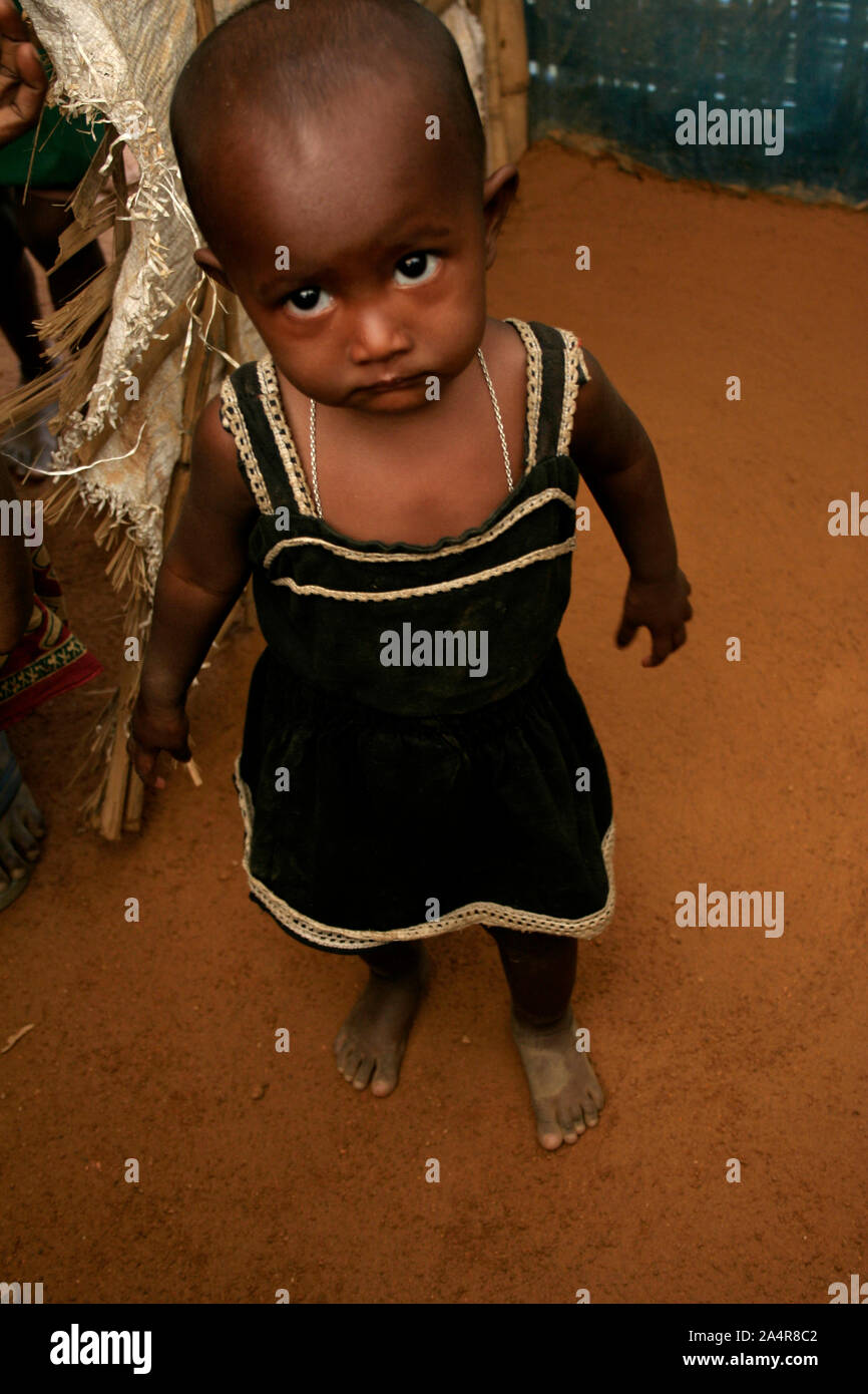 An infant inside a shack in the slum of labourers, in Jaflong, Sylhet ...