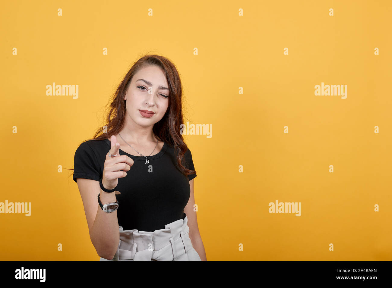 Girl winking close up hi-res stock photography and images - Alamy