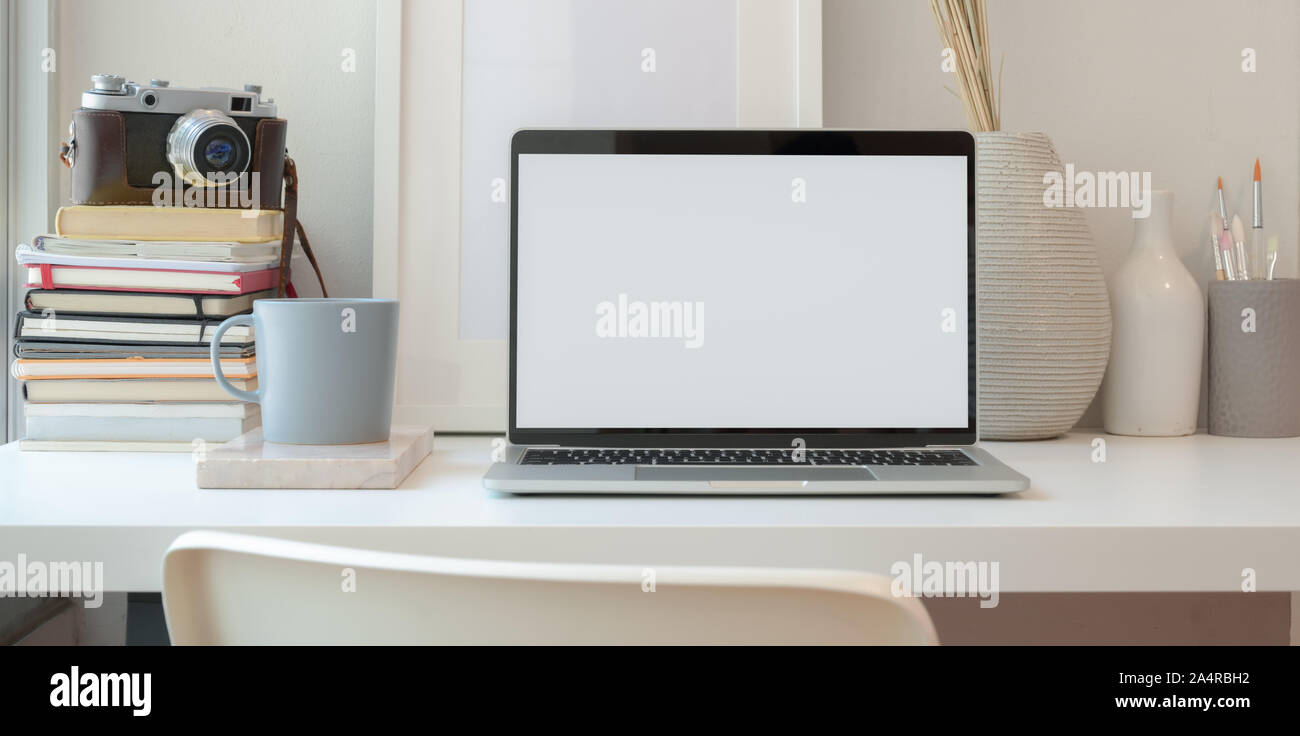 Open blank screen laptop computer in minimal workspace with office ...