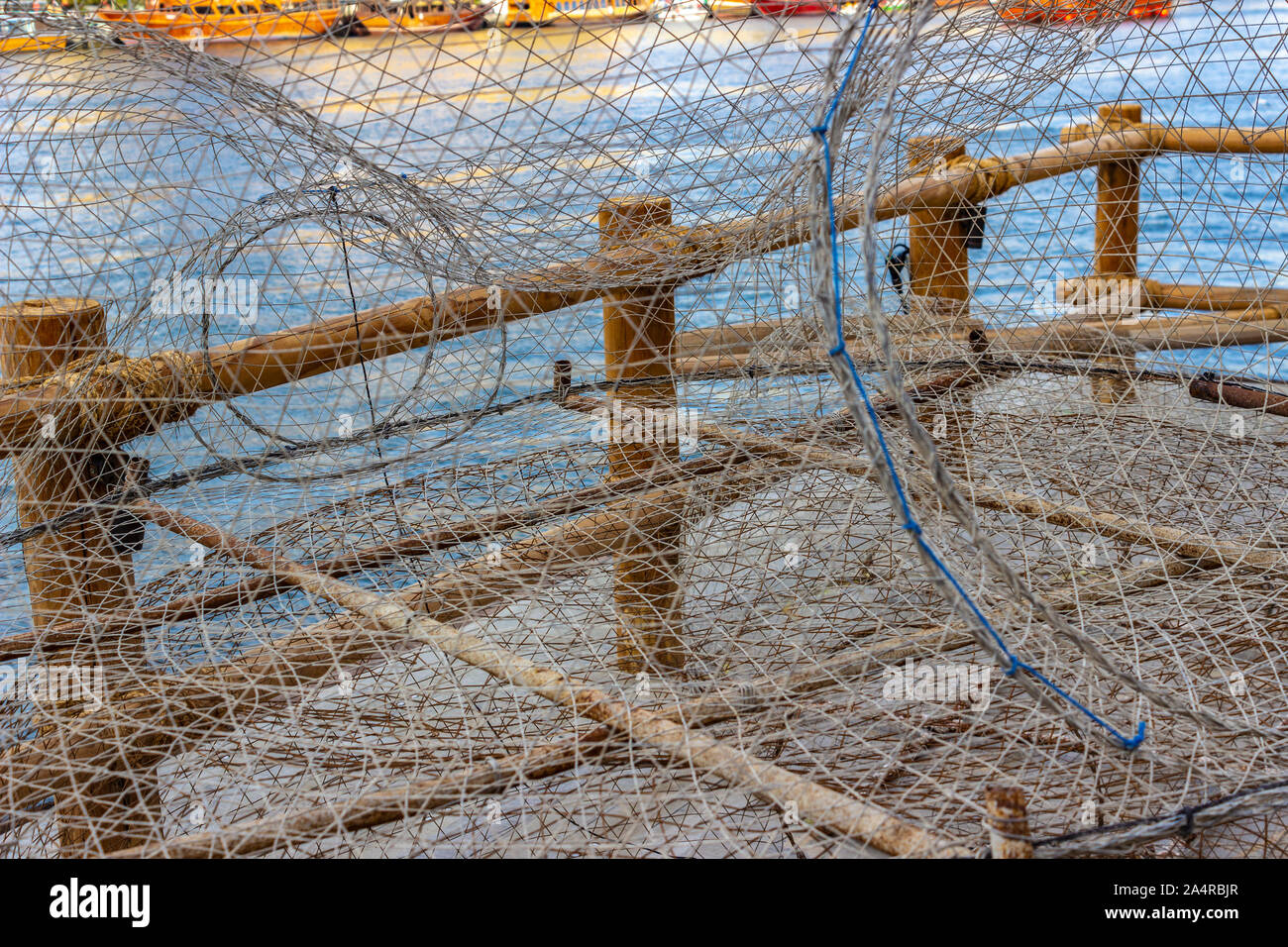 Large nets for fishing lie on the shores of the city bay Stock Photo ...
