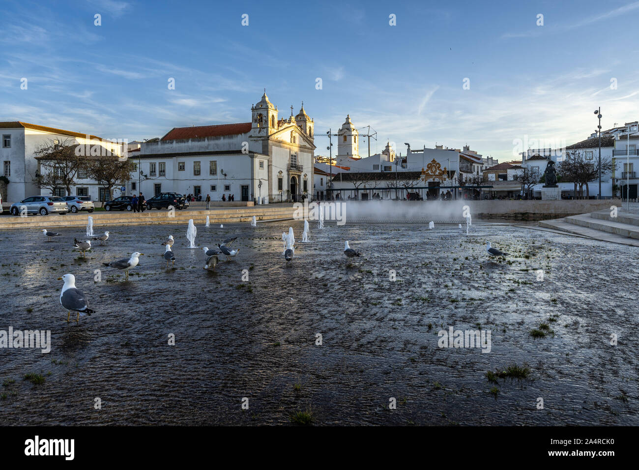 Scenic sunset view of Lagos. Seagulls and fountains and St. Mary's ...