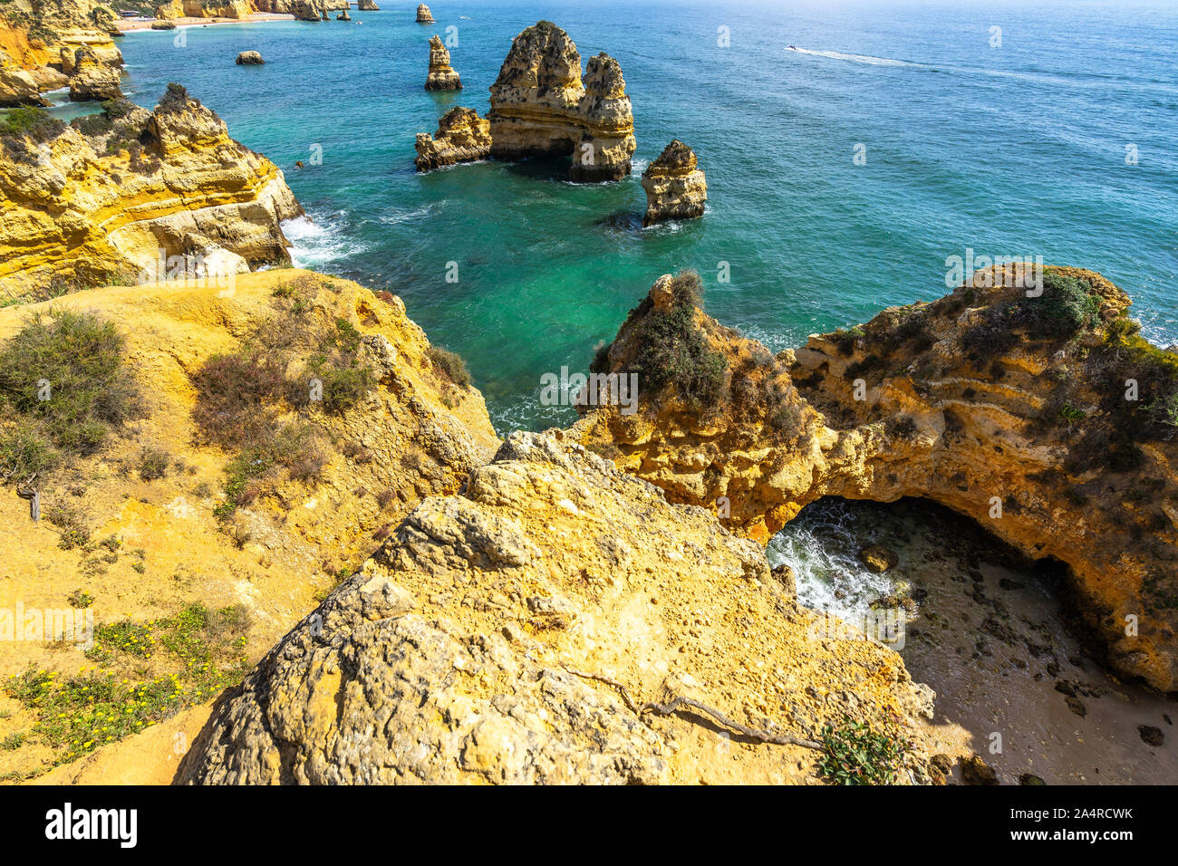Typical limestone cliffs of Algarve coast near Praia do Camilo beach ...