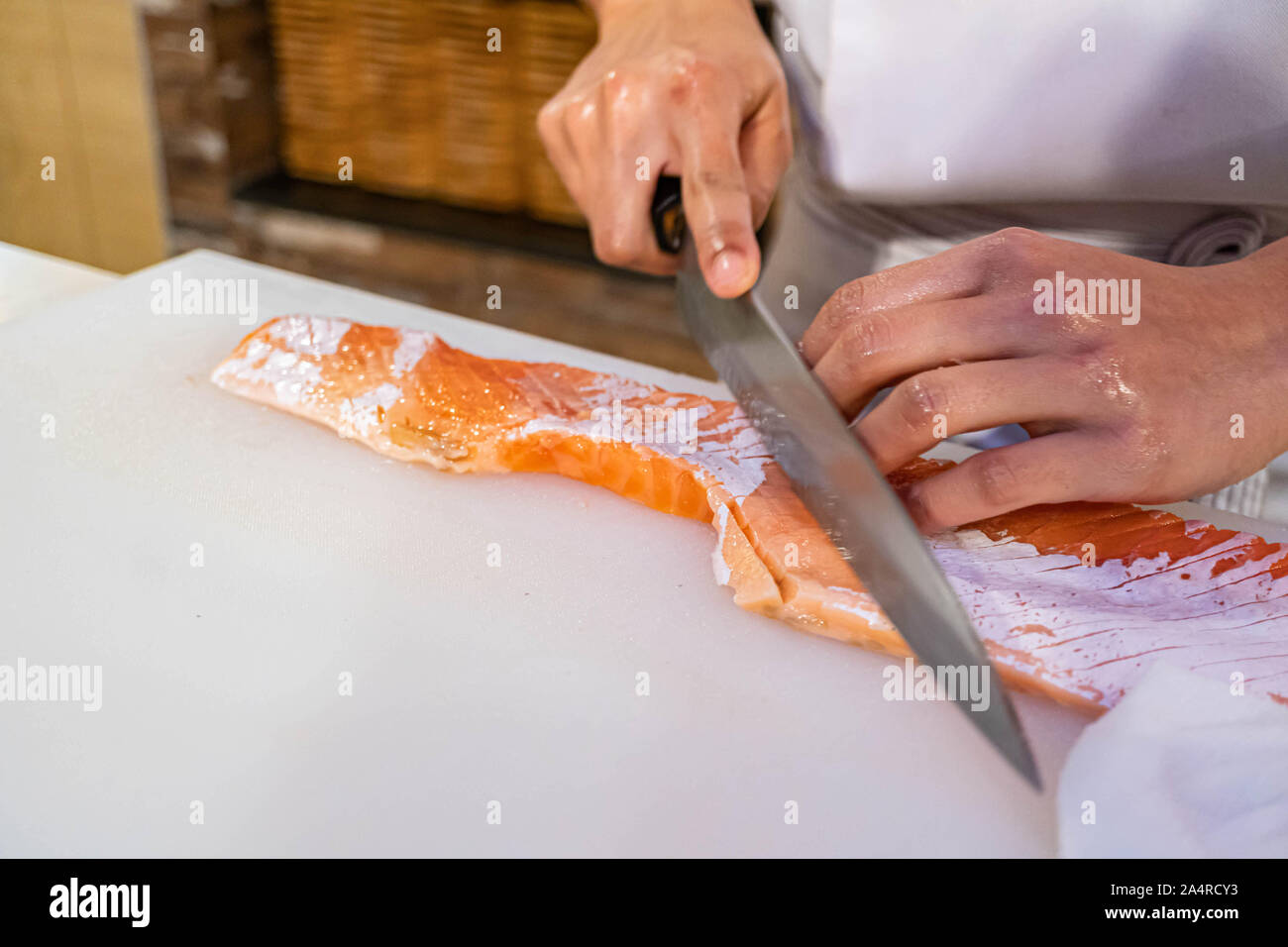 Person cutting fish hi-res stock photography and images - Alamy