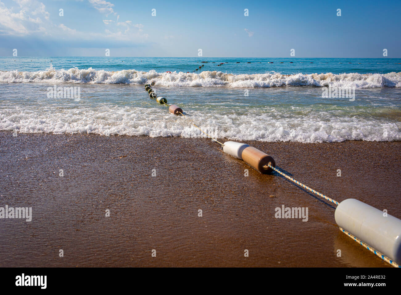 at the beach a barrier line leads into the sea with the best weather ...