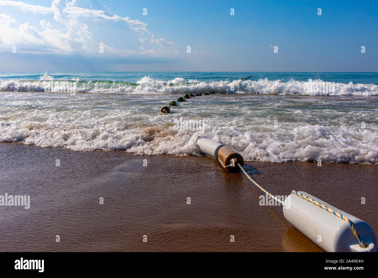 at the beach a barrier line leads into the sea with the best weather ...