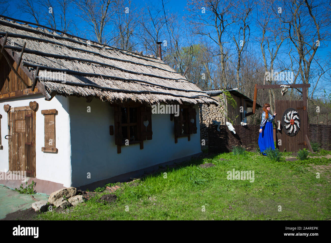 Girl near the old pagan house Stock Photo - Alamy