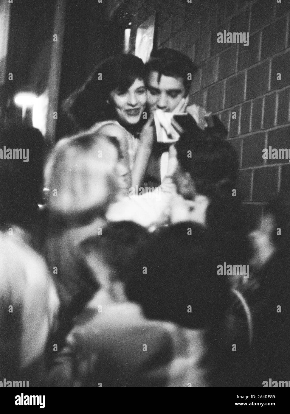 Elvis Presley being swarmed by fans at the University of Dayton ...