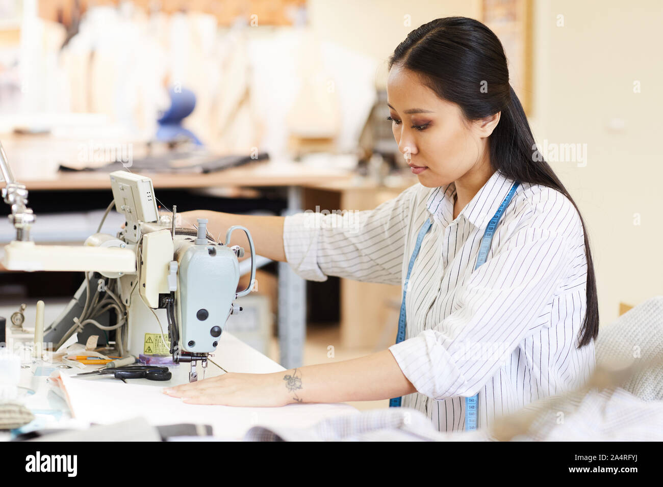Asian women using sewing machine hi-res stock photography and images ...