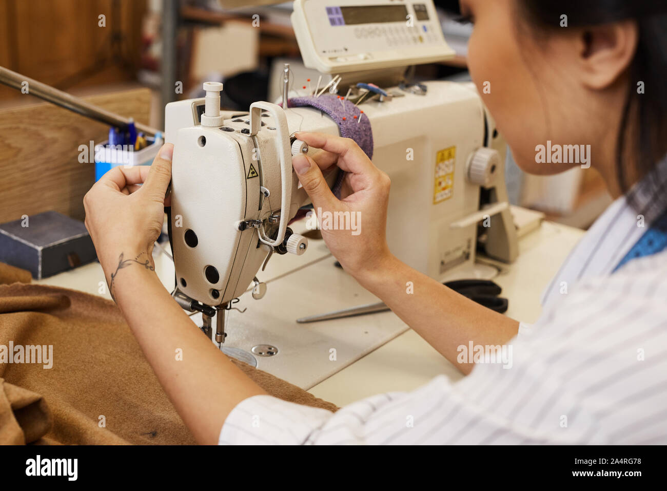 Tailor sitting hi-res stock photography and images - Alamy