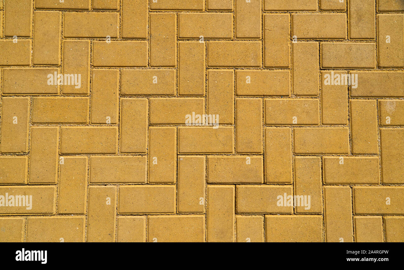 yellow and grey paving tile for background or texture Stock Photo - Alamy