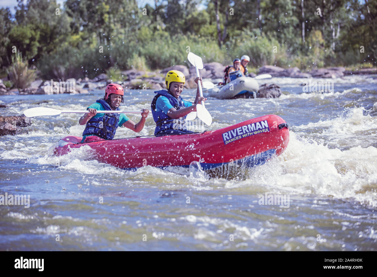 Two people rafting at Riverman Cabins Stock Photo - Alamy