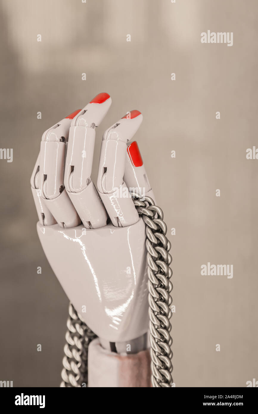 wood model hand holding metal chain display Stock Photo - Alamy
