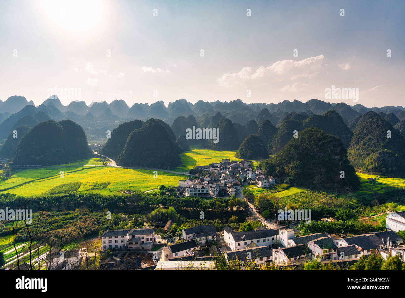 Rapeseed flower field and villages at Wanfenglin National Geological ...