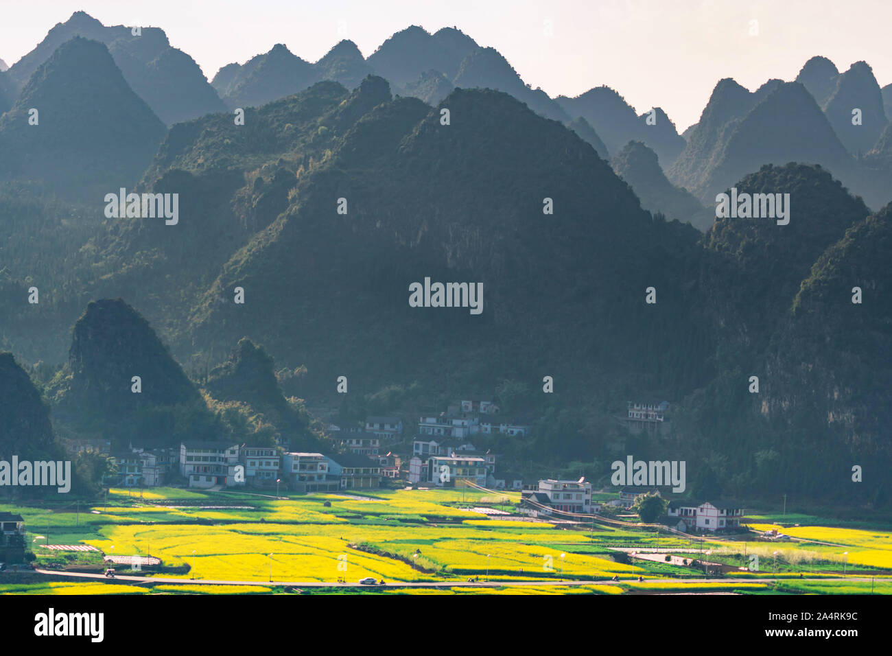 Rapeseed flower field and villages at Wanfenglin National Geological ...