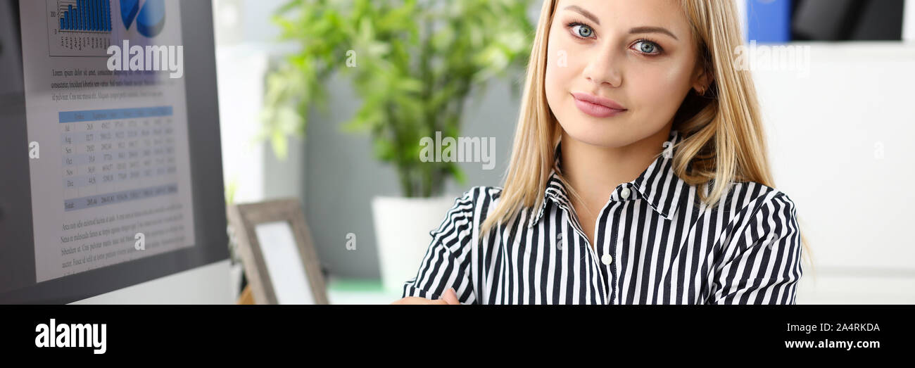 Beautiful smiling clerk looking in camera portrait Stock Photo - Alamy