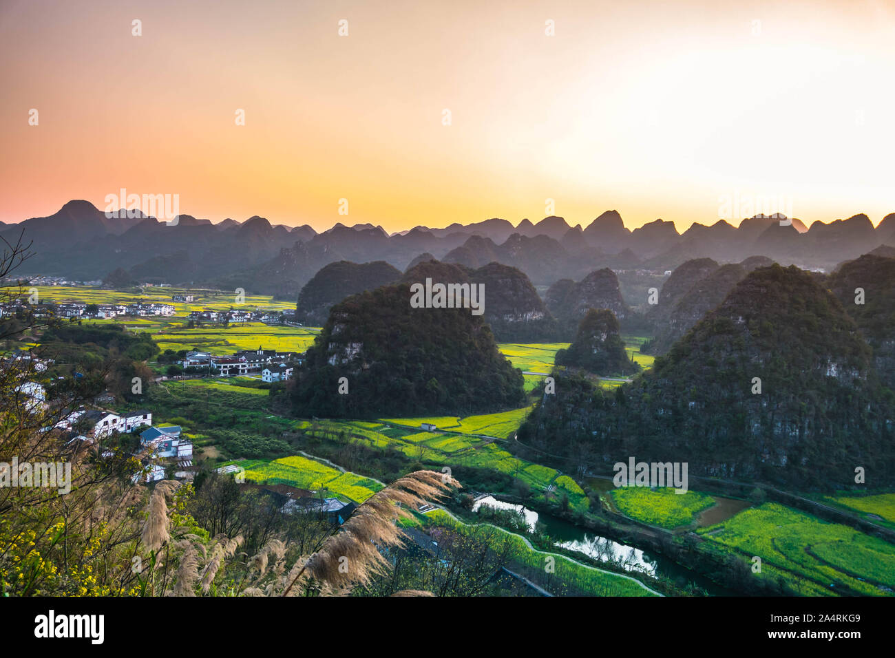Rapeseed flower field and villages at Wanfenglin National Geological ...