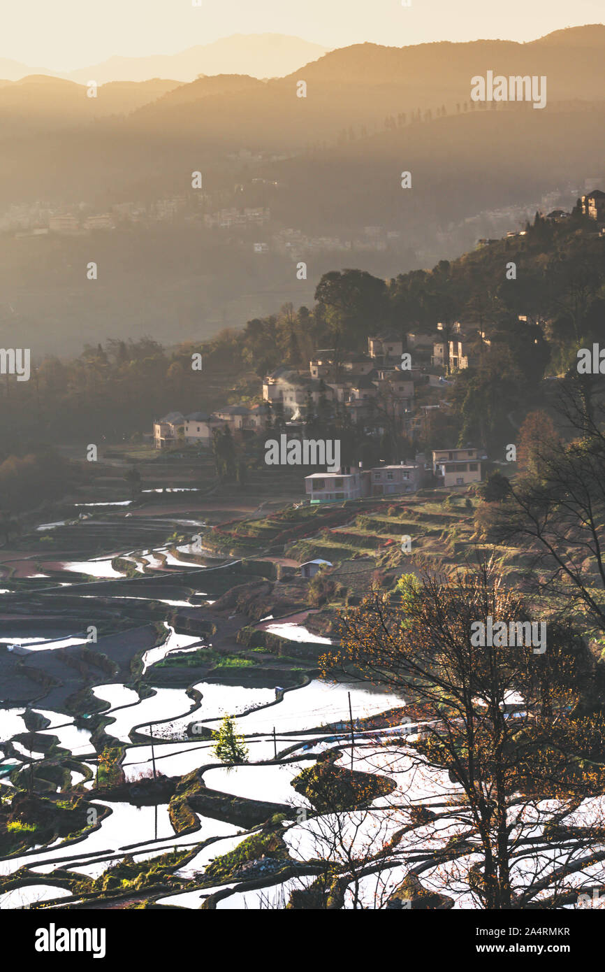 Small village and Terraced rice fields of YuanYang , China in the ...