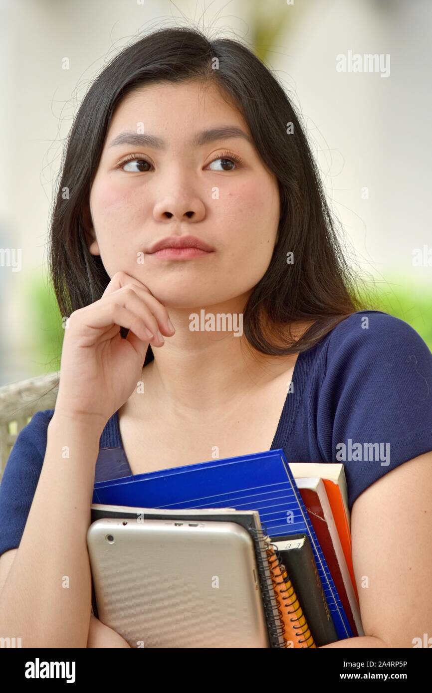 Beautiful Diverse Student Teenager School Girl Thinking Stock Photo - Alamy