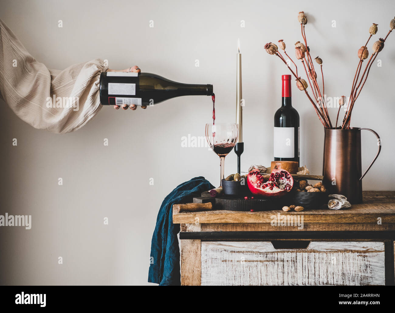Womans hand pouring wine hi-res stock photography and images - Alamy