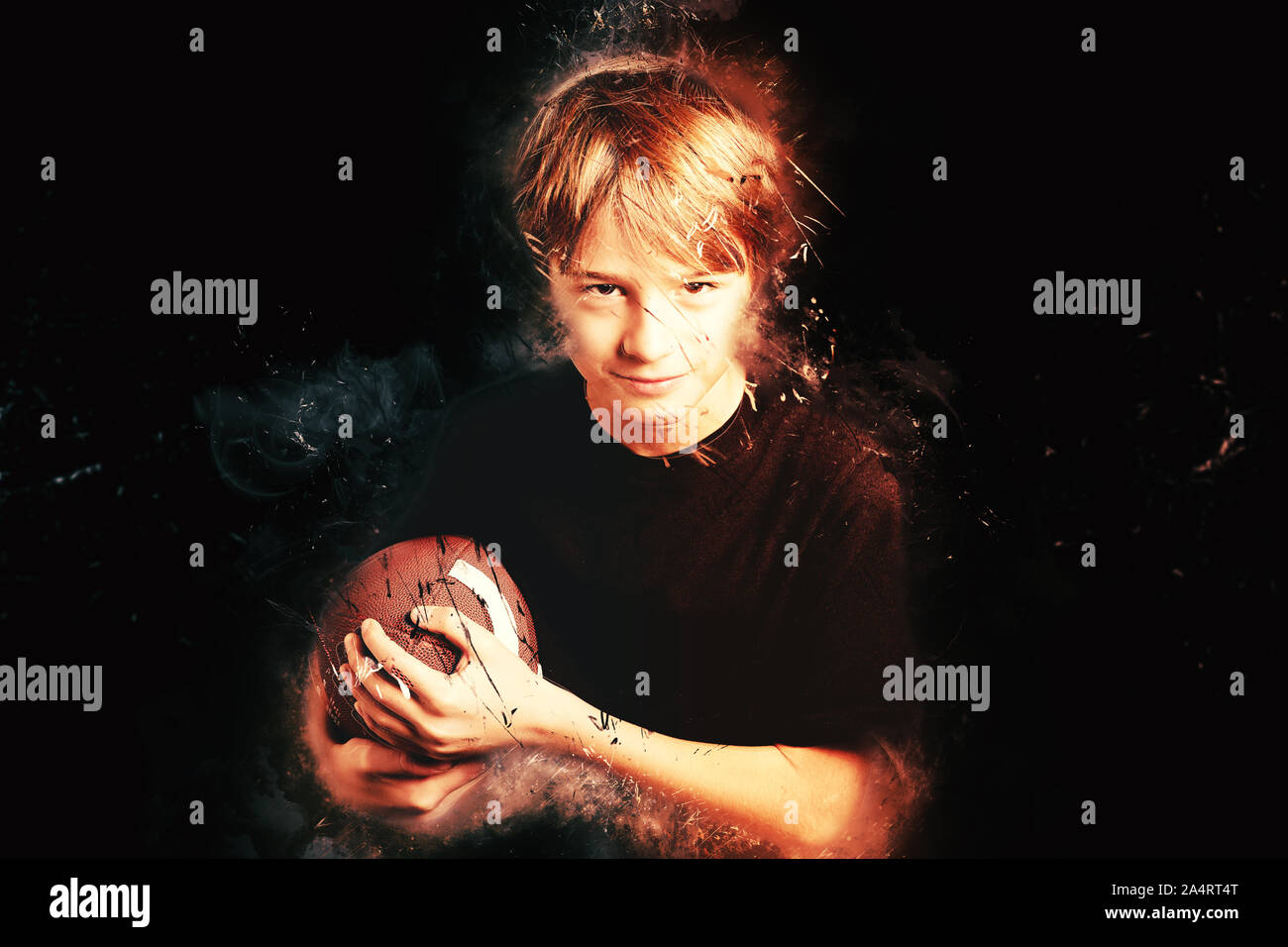 young boy rugby player on black background Stock Photo - Alamy