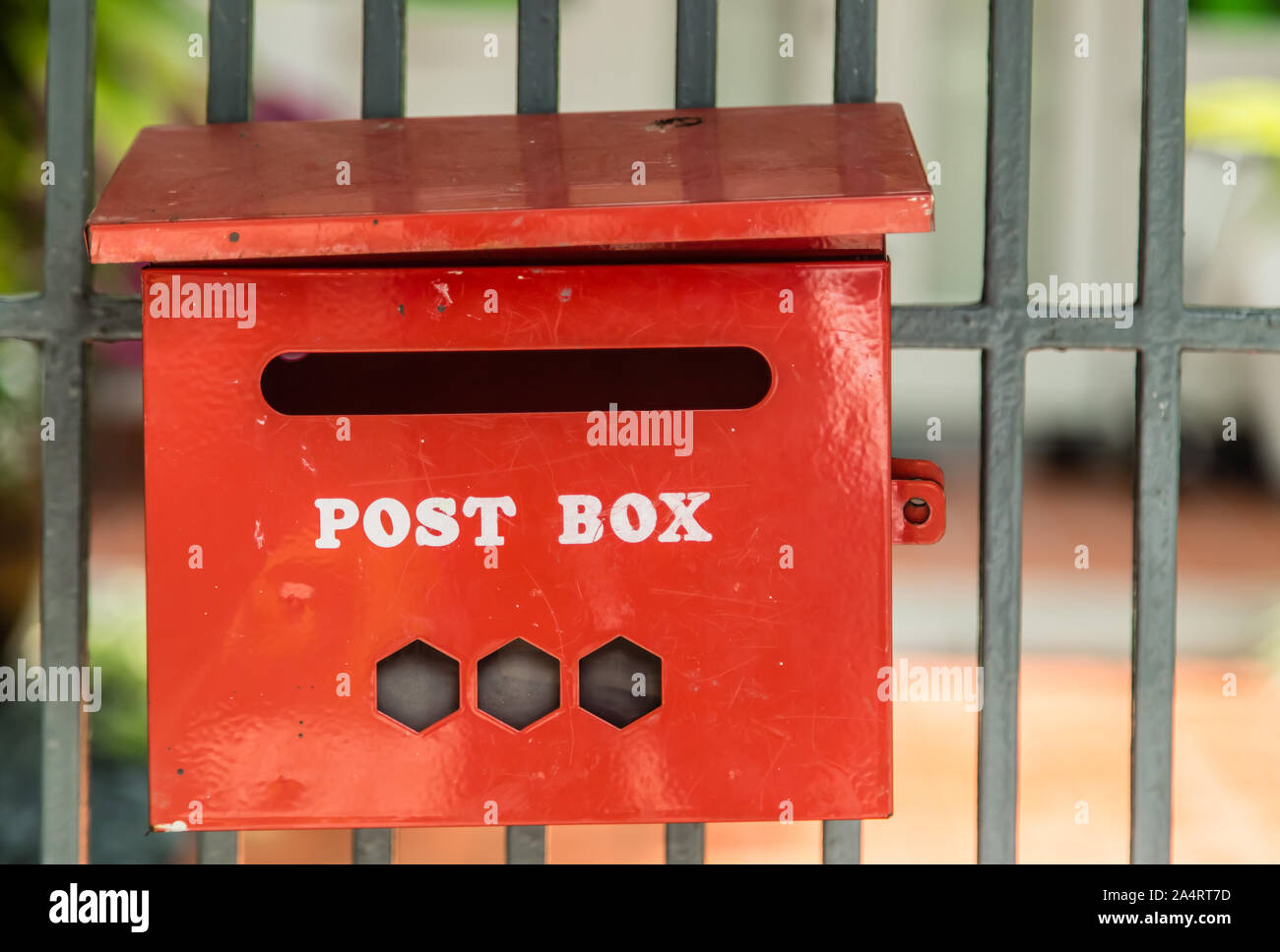 vintage style red color metal post box Stock Photo - Alamy