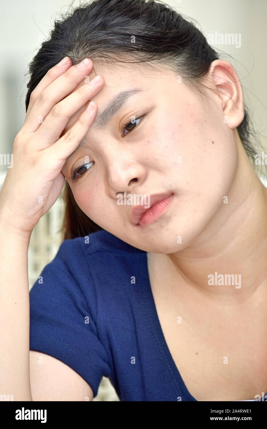 Worrisome Minority Female Stock Photo - Alamy