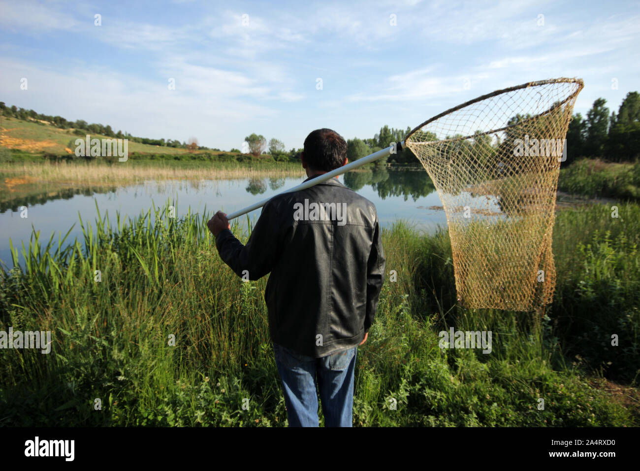 Lake and Fisherman Stock Photo - Alamy