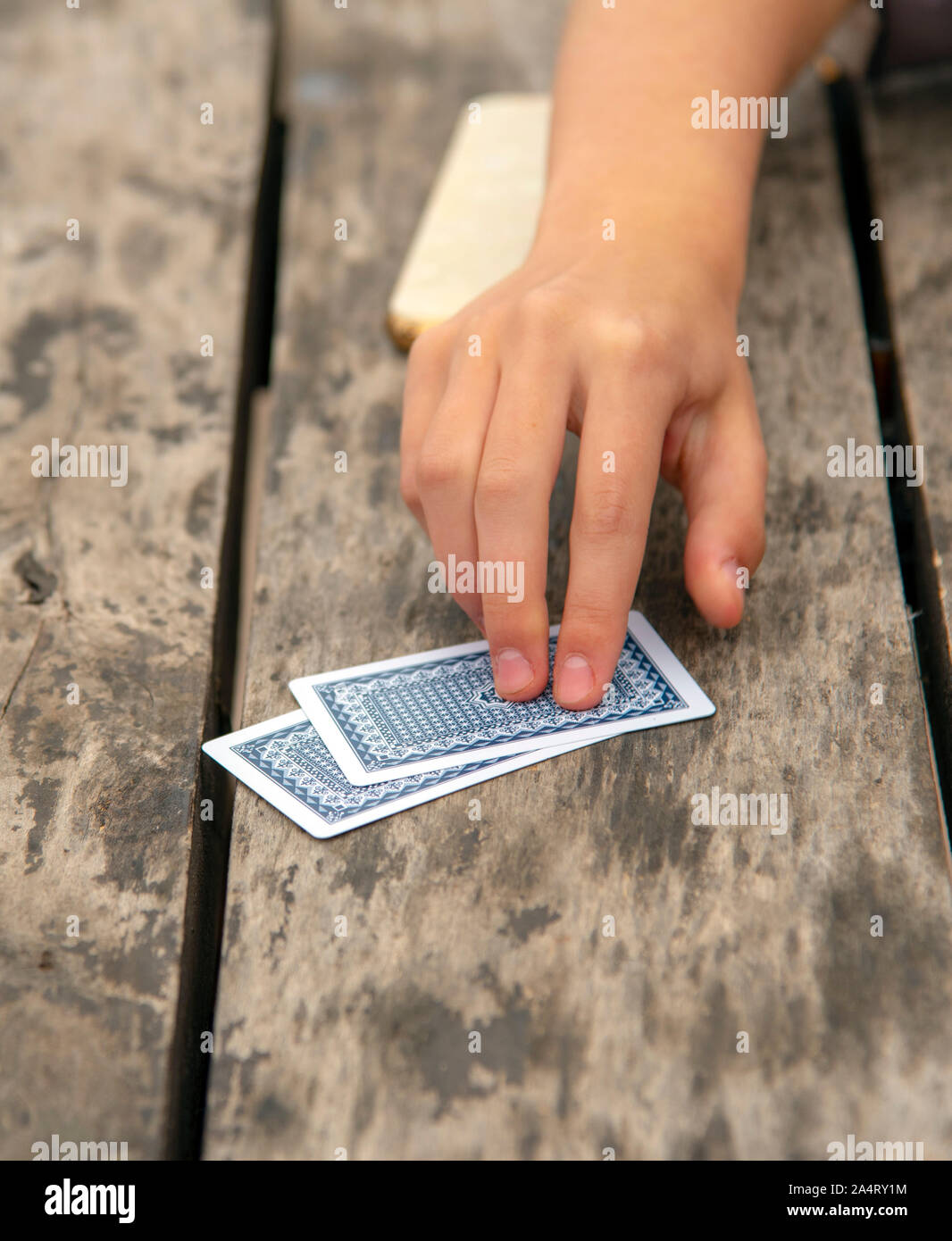 Back of hand holding cards hi-res stock photography and images - Alamy
