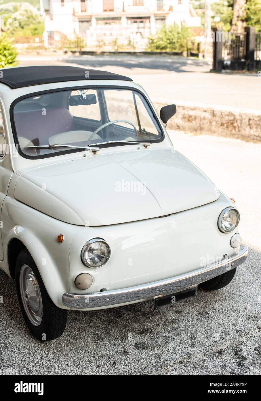 Small italian vintage car. White car Stock Photo - Alamy