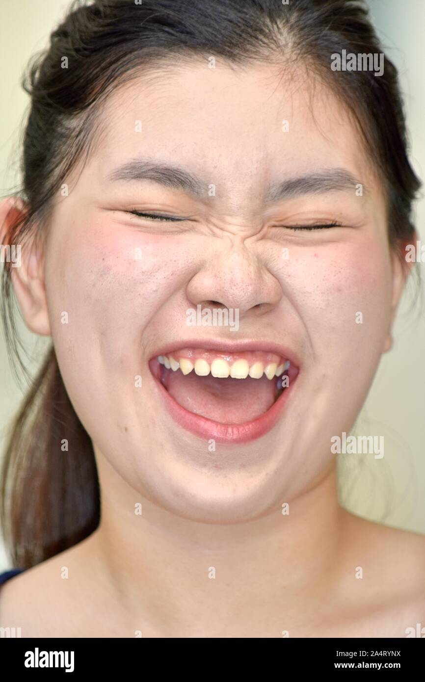 Pretty Chinese Female Laughing Stock Photo - Alamy