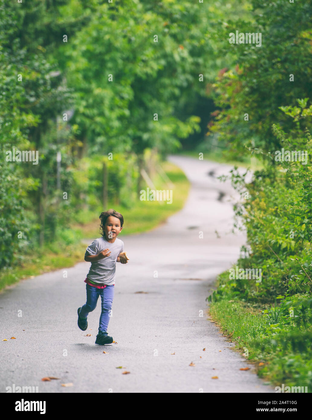Little child running on the street Stock Photo - Alamy
