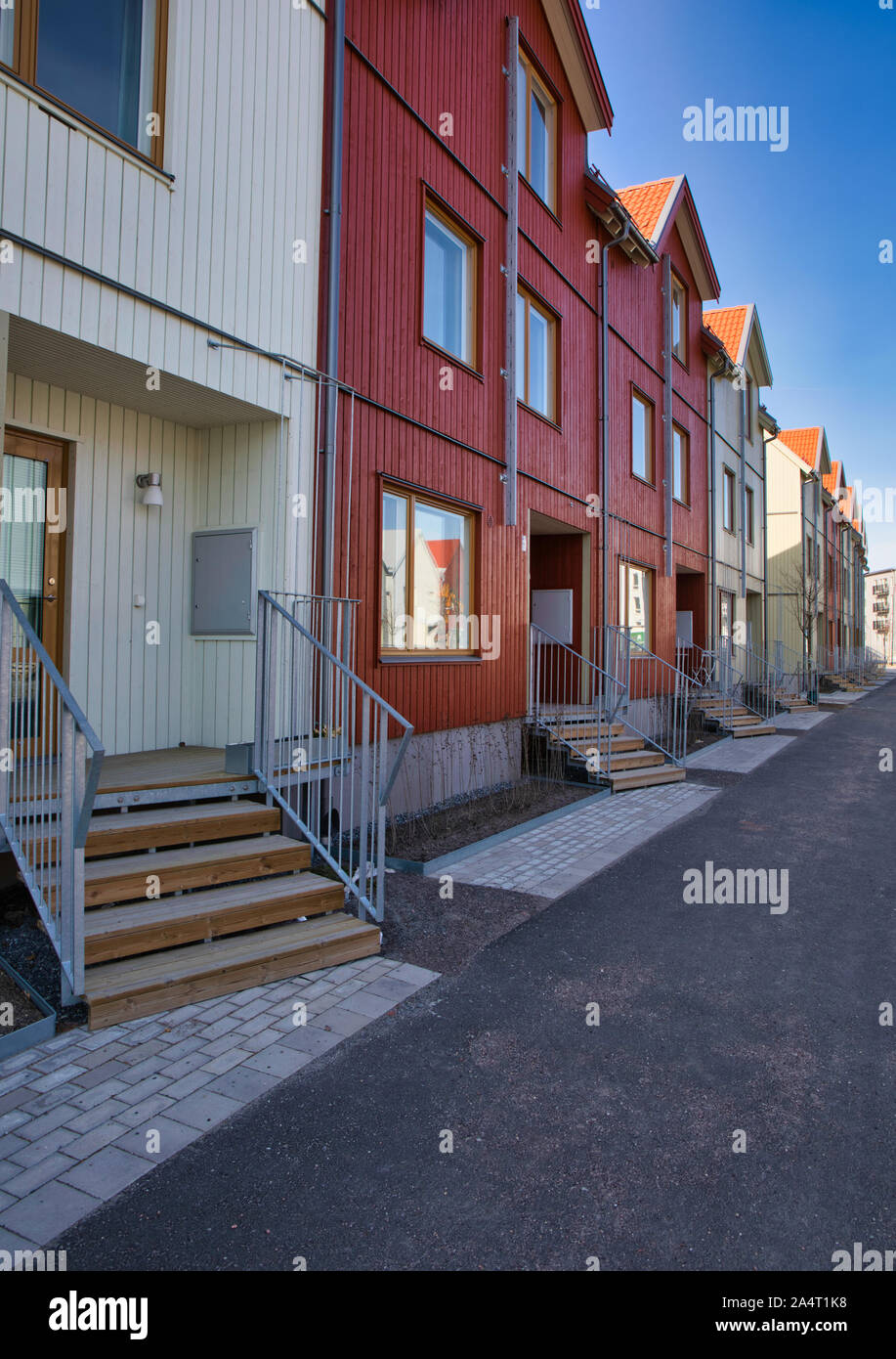 Row Of Newly Built Typical Swedish Homes In The Suburb Of Runby row-of-newly-built-typical-swedish-homes-in-the-suburb-of-runby