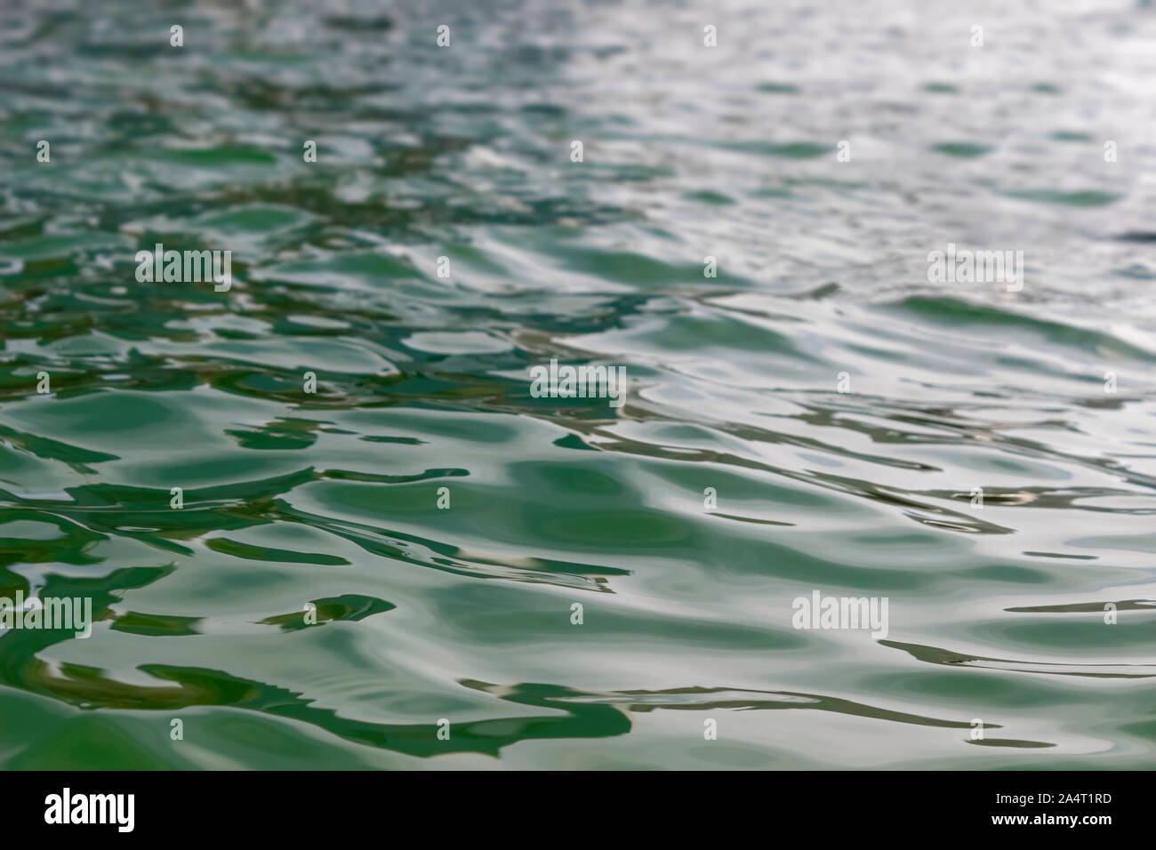 The surface of azure water as a background Stock Photo - Alamy