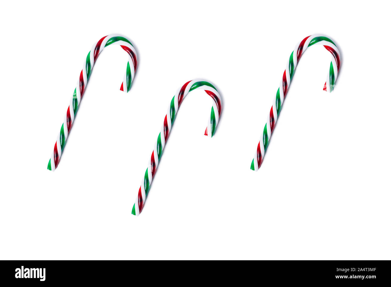 Green and red candy canes isolated on white, top view Stock Photo - Alamy