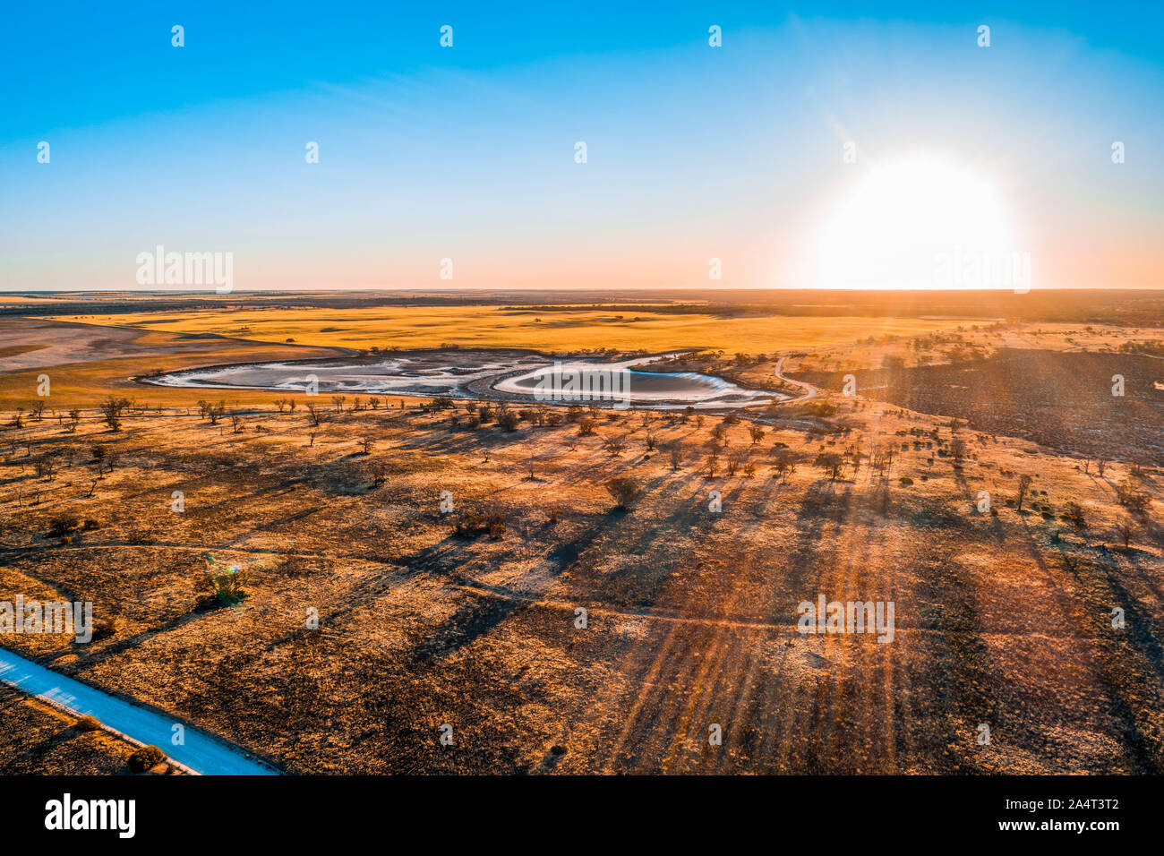 Bright sun flare over Australian desert at sunset - aerial vieww Stock ...
