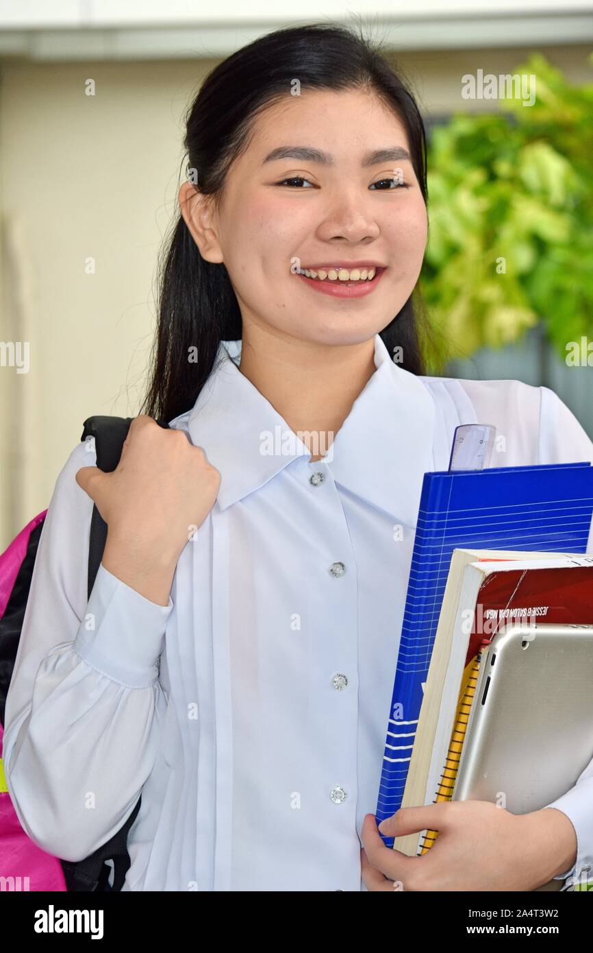 Young Chinese Girl Student Smiling With Notebooks Stock Photo - Alamy
