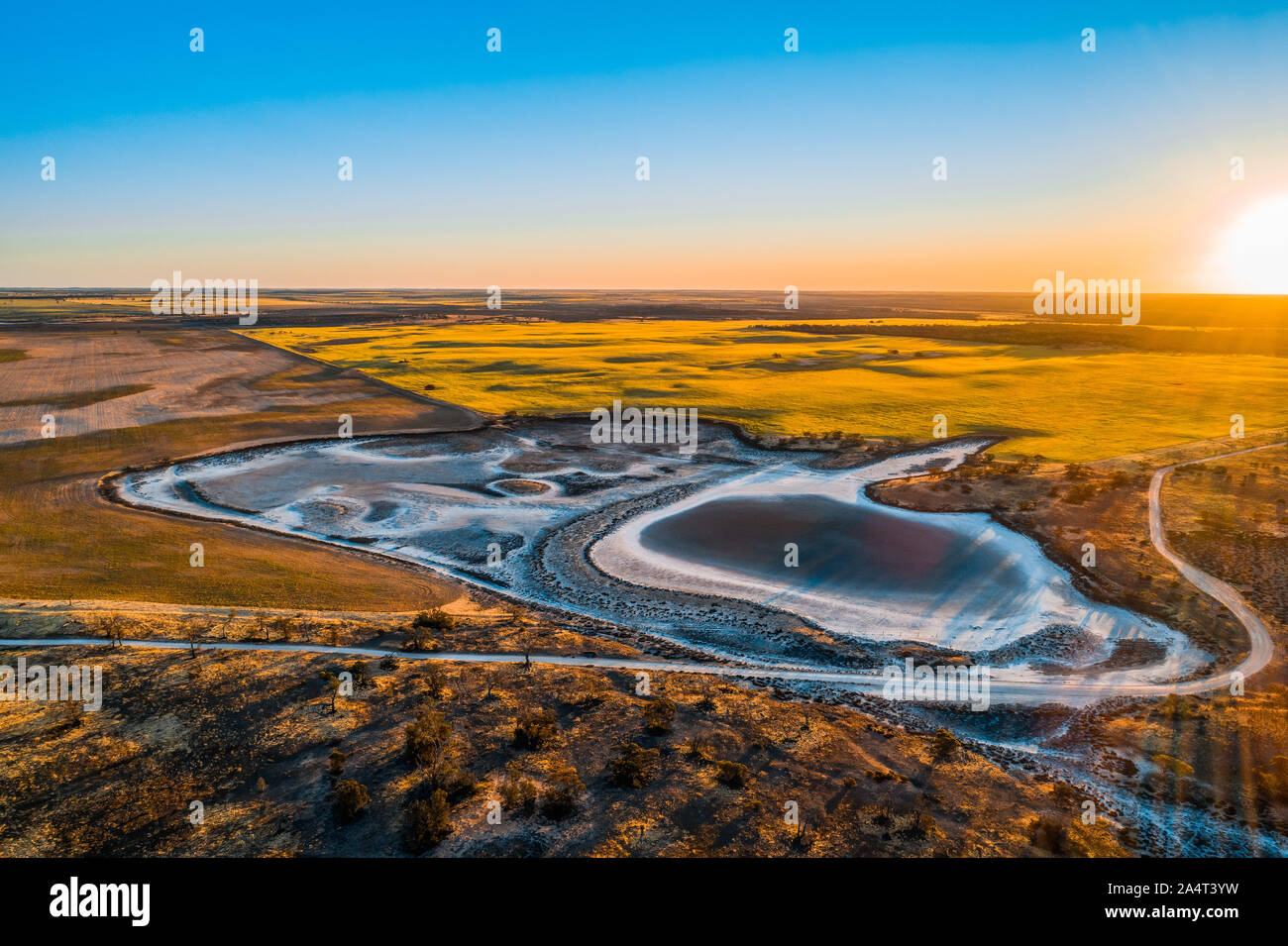 Sunset with sun flare over agricultural land and desert in Australia ...