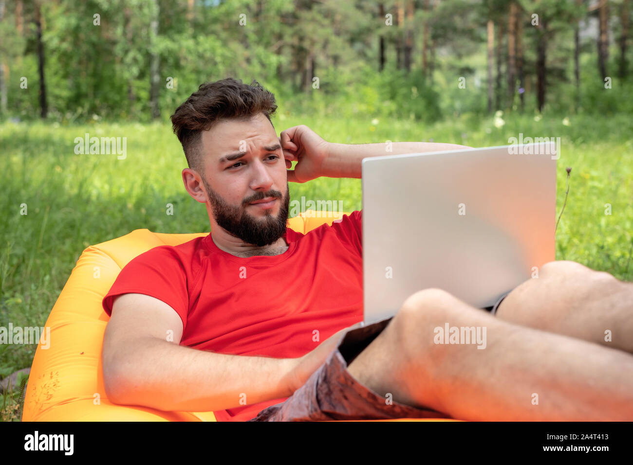 Teen student laptop. Male student with laptop studying at the campus ...