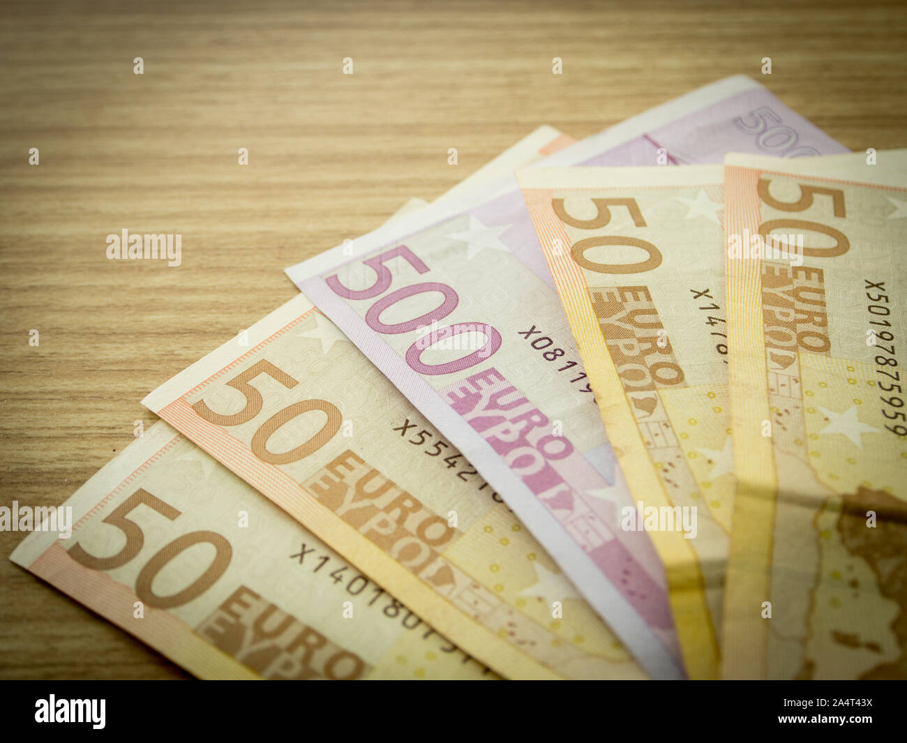euro banknote on wood table Stock Photo - Alamy