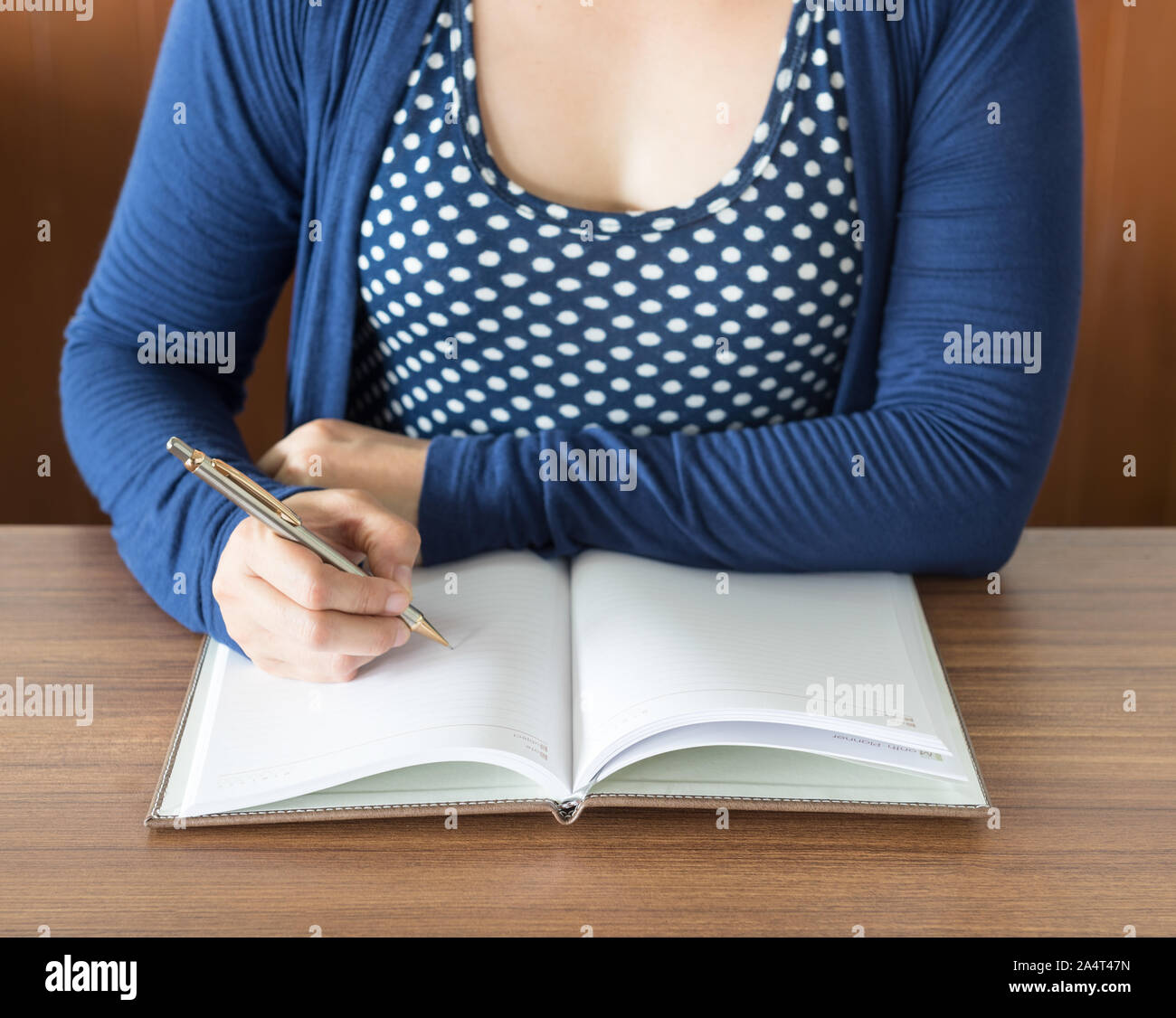 women are taking notes in a diary. select focus Stock Photo - Alamy