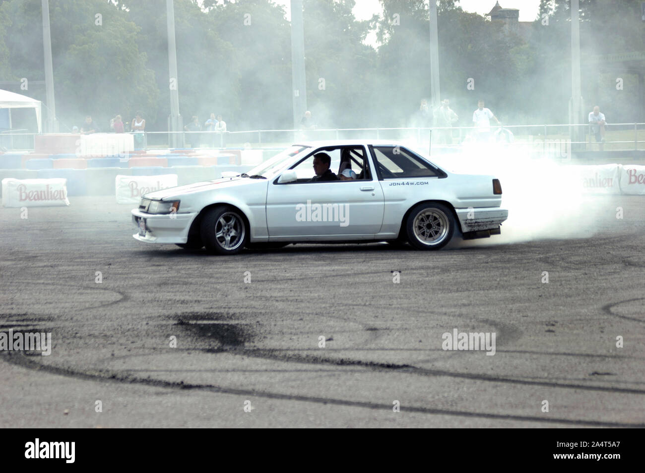 Smoking tyres during tyre burn-out Stock Photo - Alamy