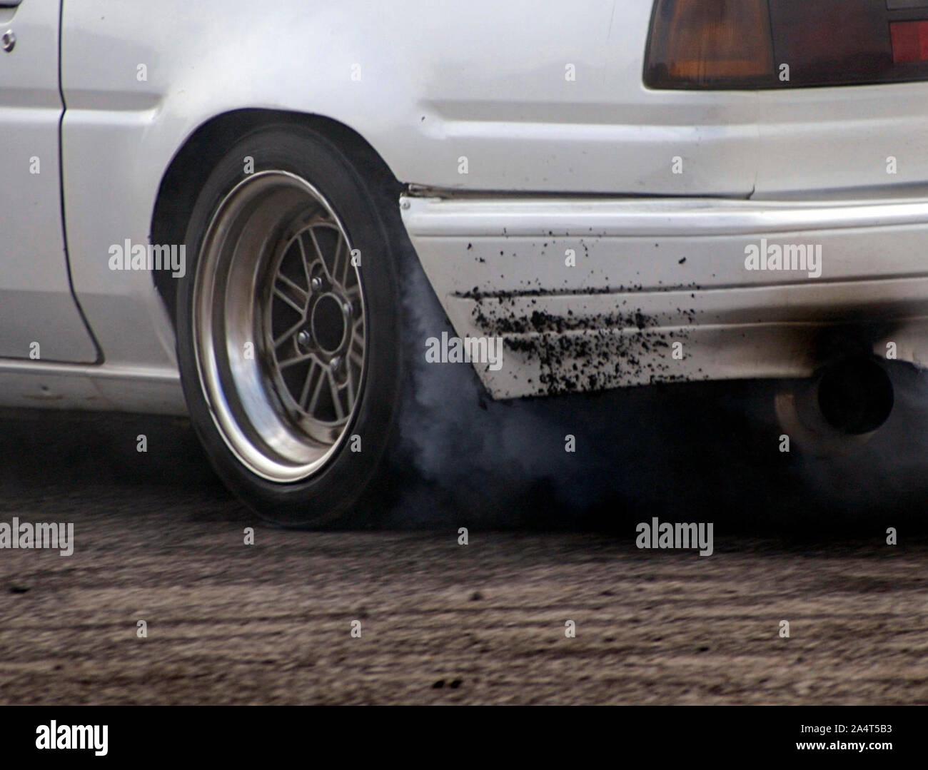 Smoking tyres during tyre burn-out Stock Photo - Alamy