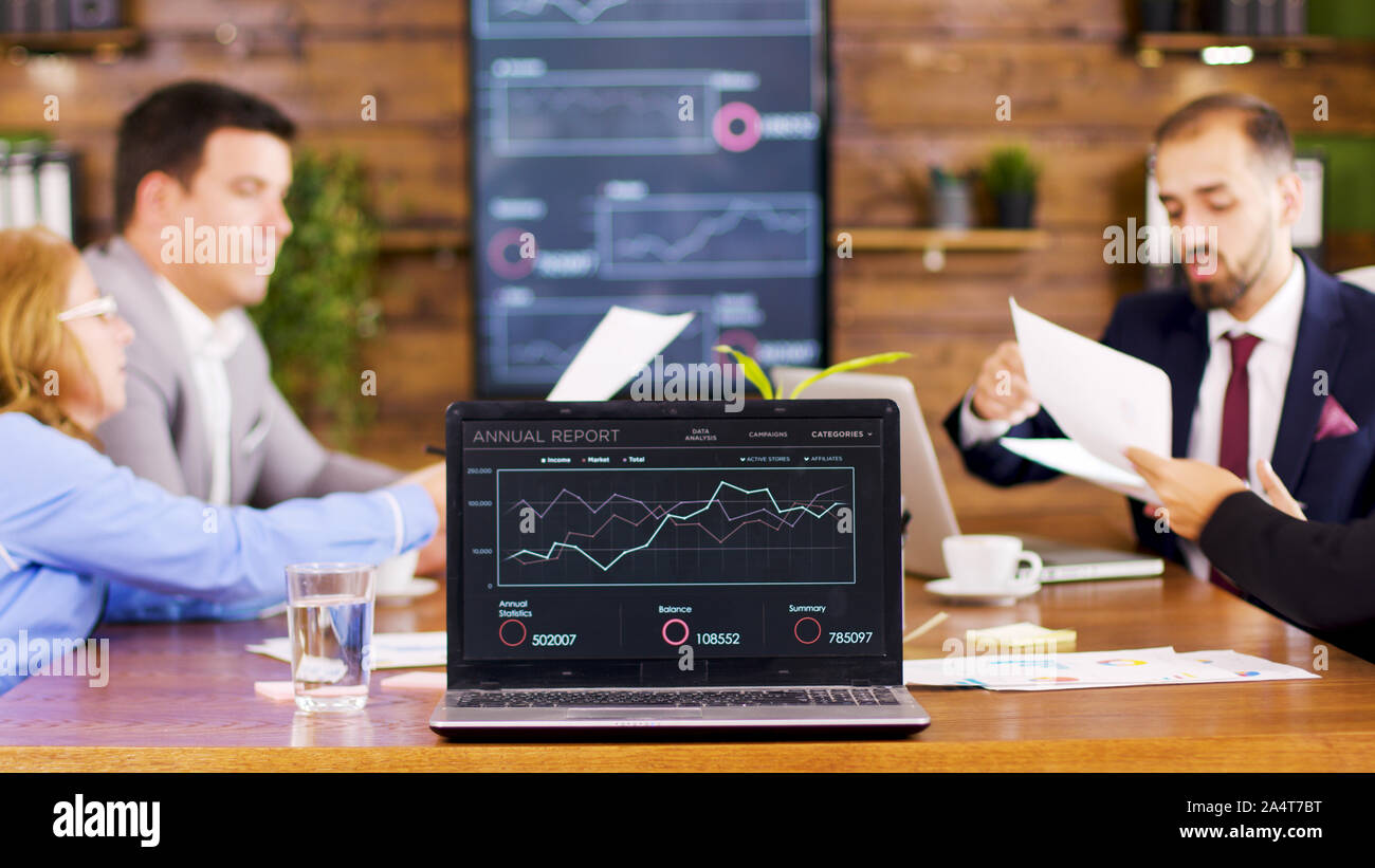 On the table laptop showing charts in the conference room. Business ...