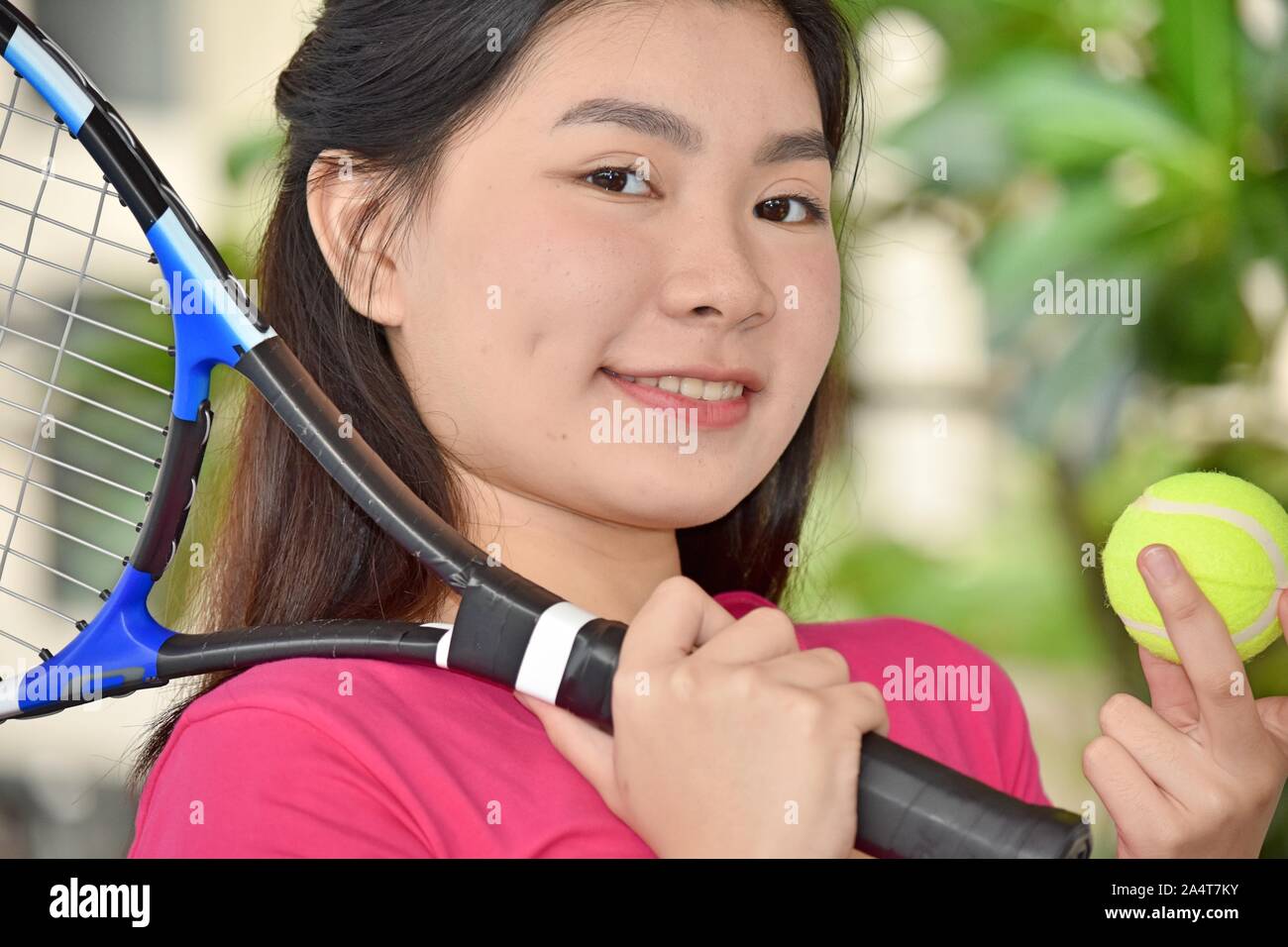 Chinese Female Athlete Smiling With Basketball Stock Photo - Alamy