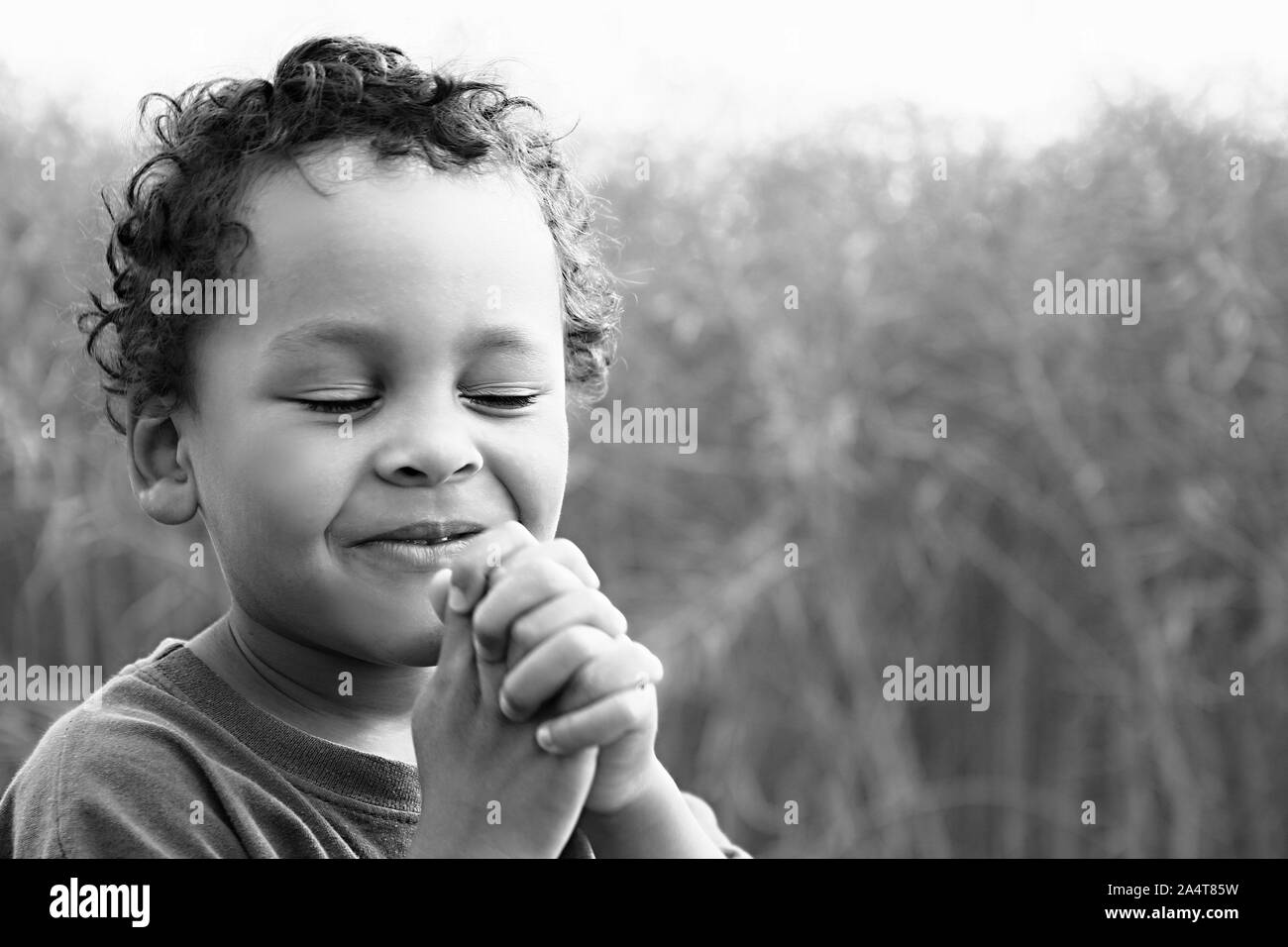 Christian children praying Black and White Stock Photos & Images - Alamy