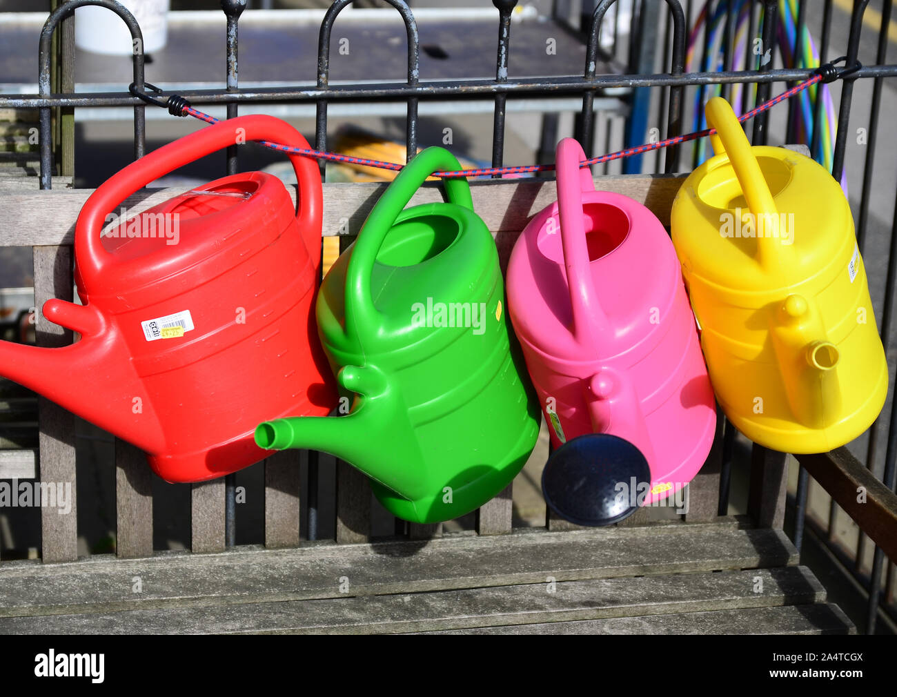 Hanging watering cans hi-res stock photography and images - Alamy