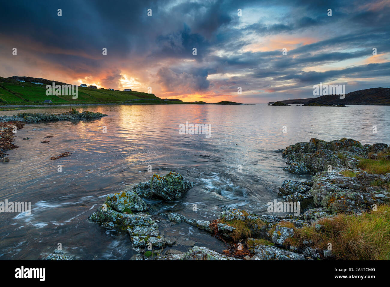 Dramatic sunset sky over the beach at Scourie in the Highlands of ...